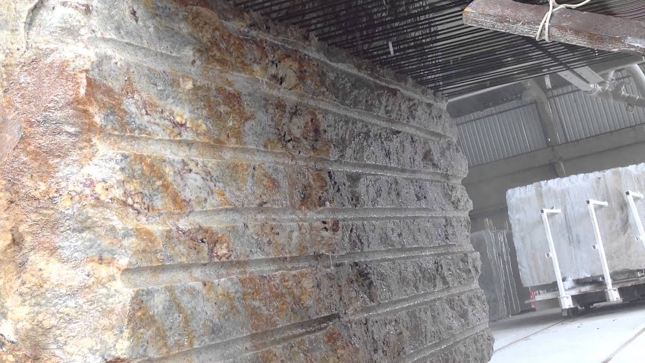Wire saws cutting through a block of granite - YouTube