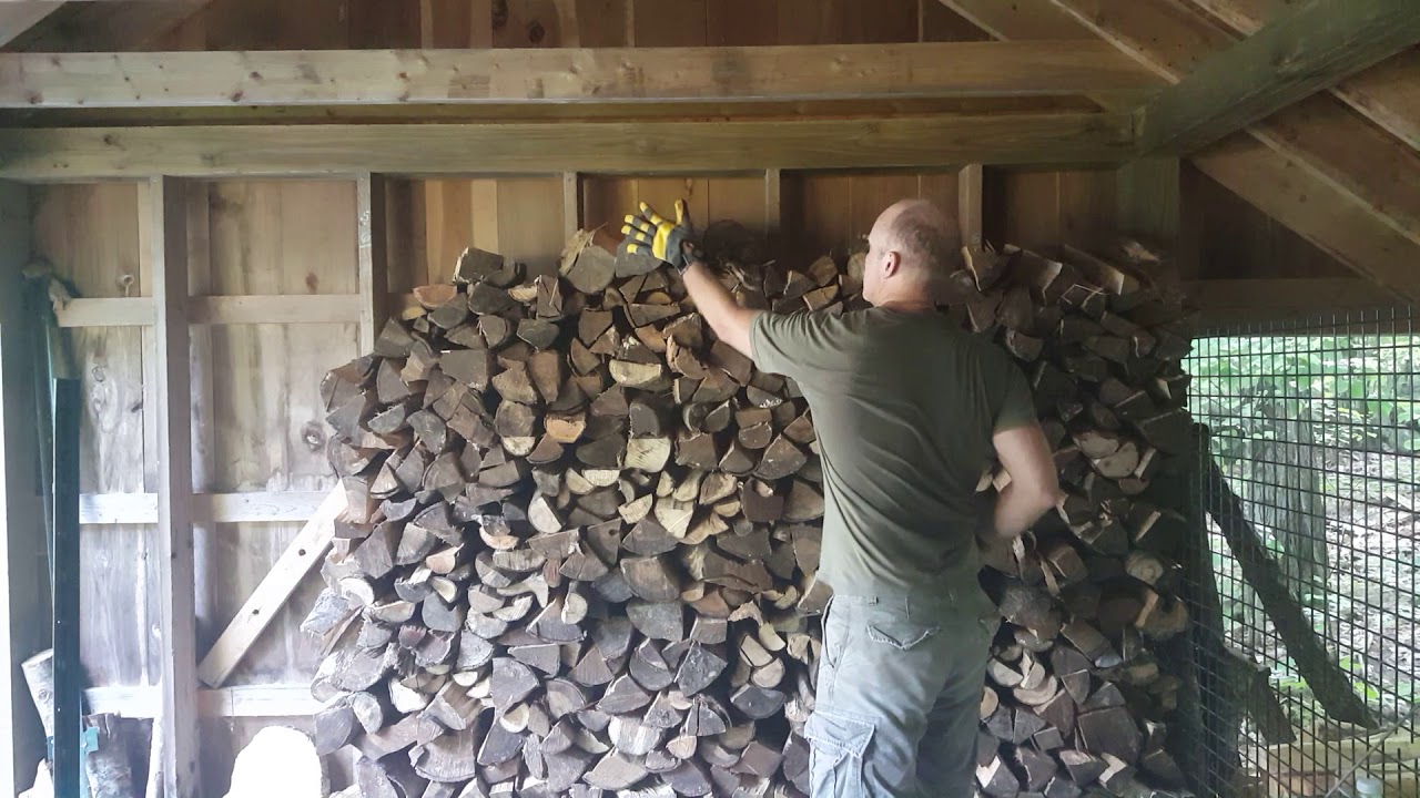 Stacking firewood properly for easy winter retrieval. - YouTube