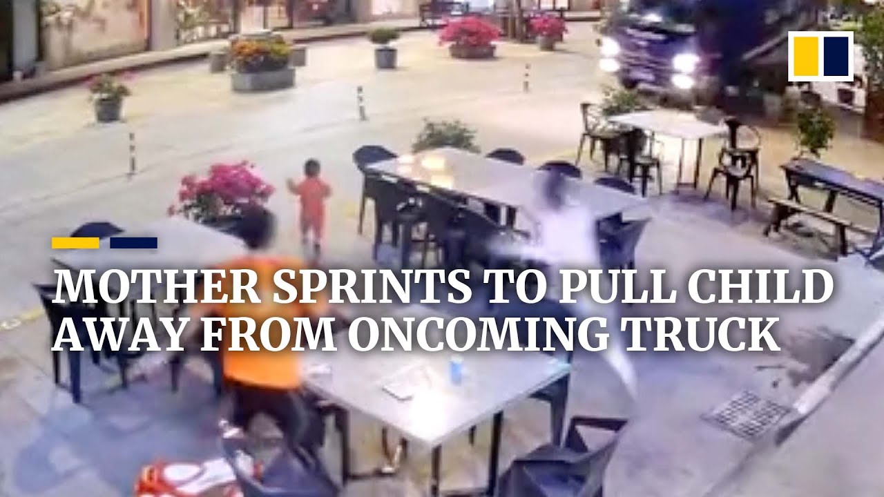 Chinese mother sprints to pull child away from oncoming truck - YouTube