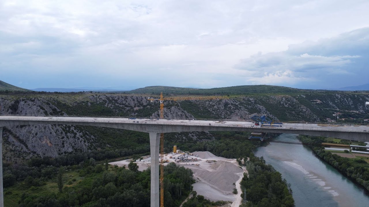 The Počitelj bridge is connected to the left bank of the Neretva River ...