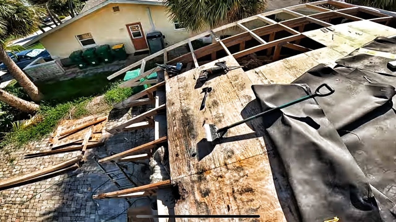 Tearing out damaged/rotted roof decking - YouTube