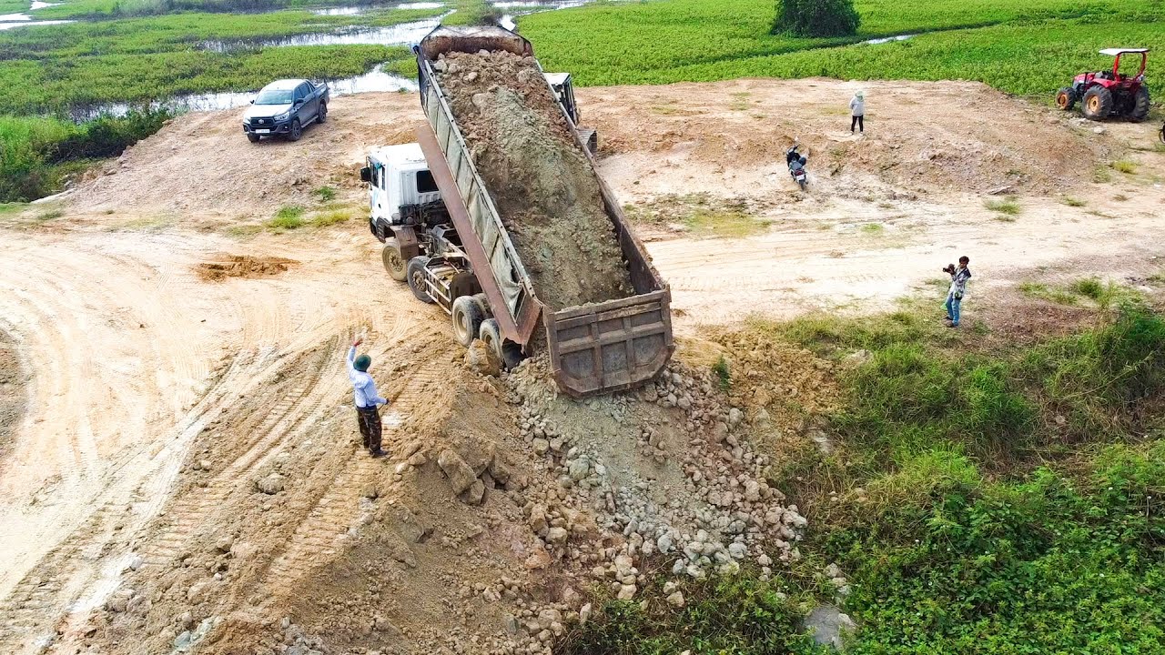 Fantastic Backfill Showing With Bulldozer Pushing Dirt & Dump Truck ...