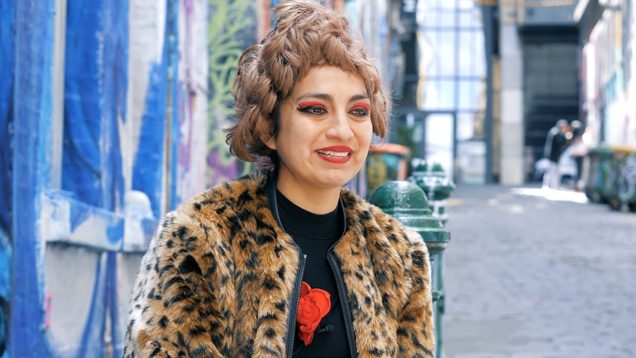 Dancing busker tells her story - YouTube