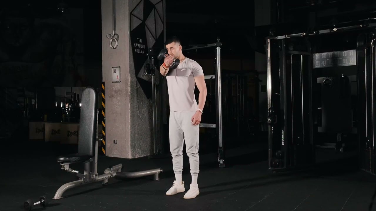 standing single arm dumbbell diagonal chest raise - YouTube