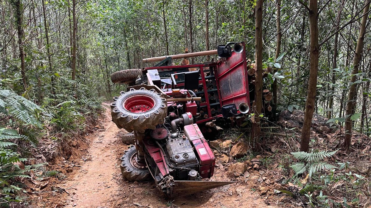 Overloaded tractor carrying wood overturned on dangerous hill - YouTube