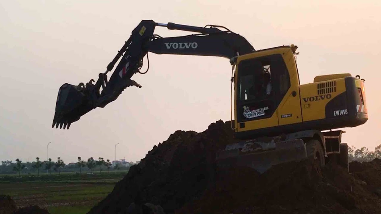 New project groundbreaking, Volvo EW145B sand excavator, Road roller ...
