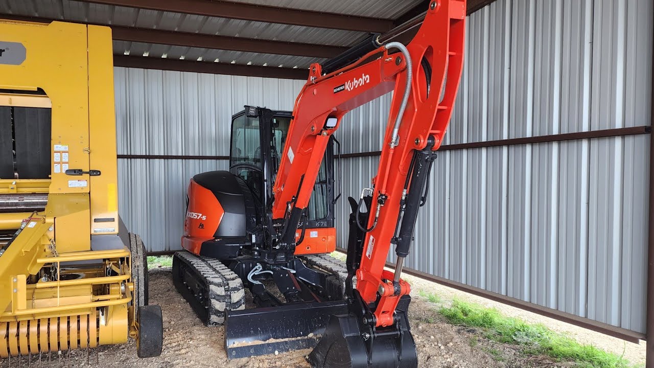 Putting in a culvert with our new Kubota KX-057-5! - YouTube
