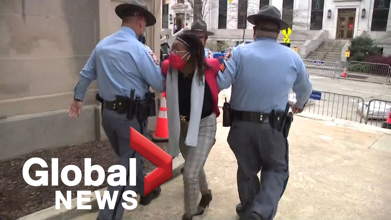 Georgia lawmaker arrested as governor signs election reform law - YouTube