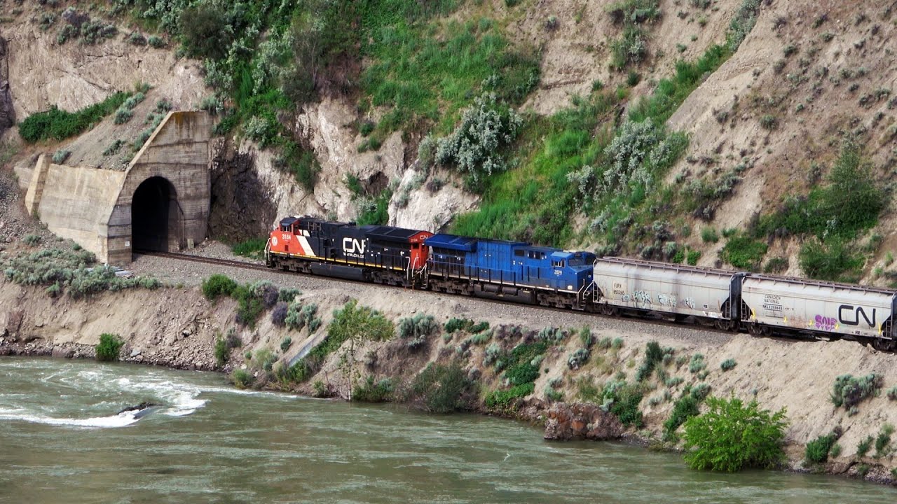 Huge CN Trains Thru Tunnels And Bridges Along With A Train Meet Between ...