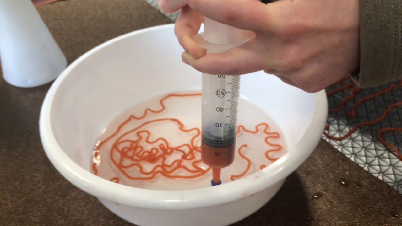 Extruding Alginate BioYarn with a syringe. - YouTube