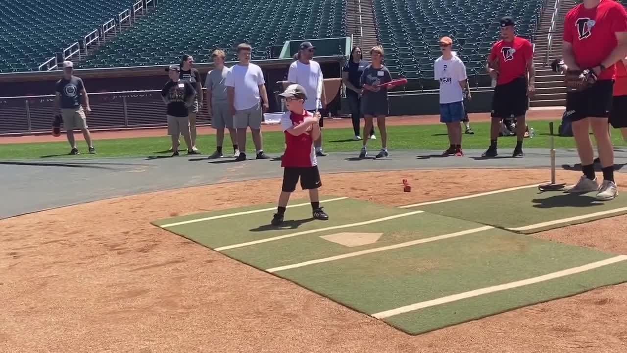 People with disabilities play baseball with the Lansing Lugnuts - YouTube
