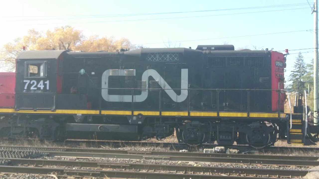 CN EMD GP9RM 7241 & GP9RM 7246 In Oakville crossing - YouTube