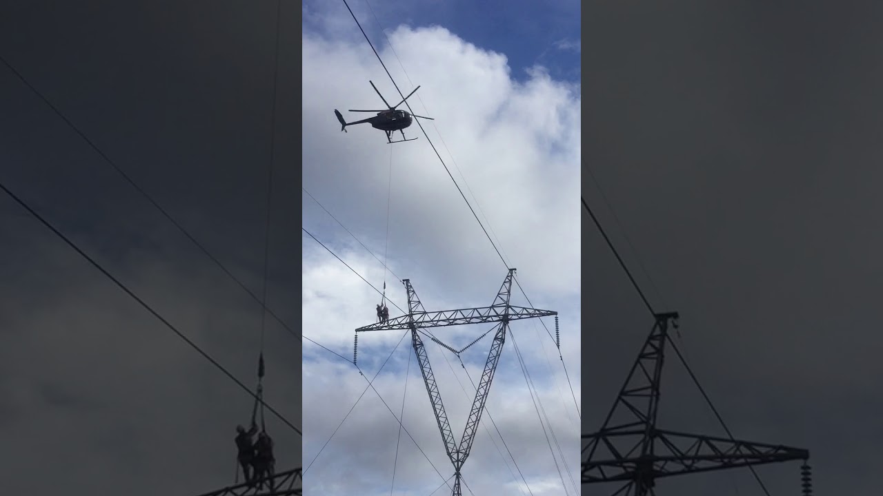Linemen working on high voltage lines with helicopter - YouTube