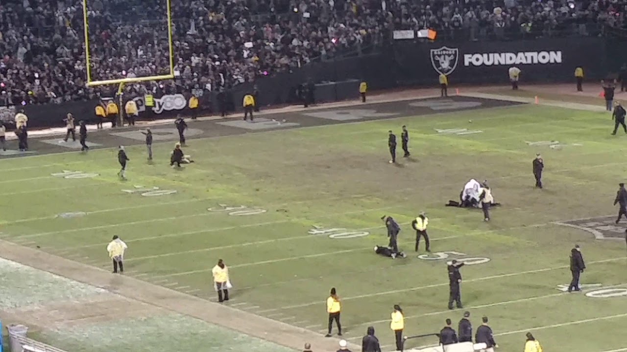Fans rush the field after Raiders Broncos Game in Oakland - YouTube