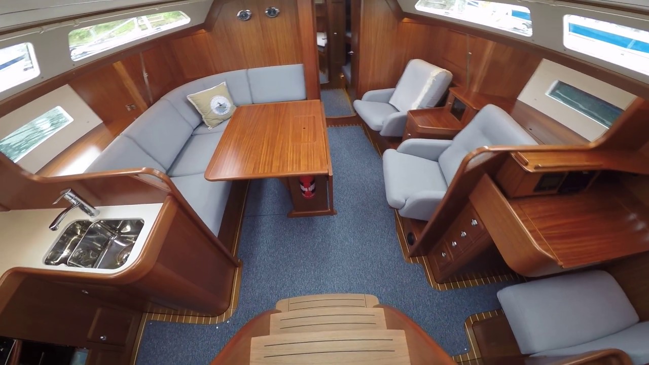 Hallberg-Rassy 44 interior walk through. Mahogany interior, armchairs ...