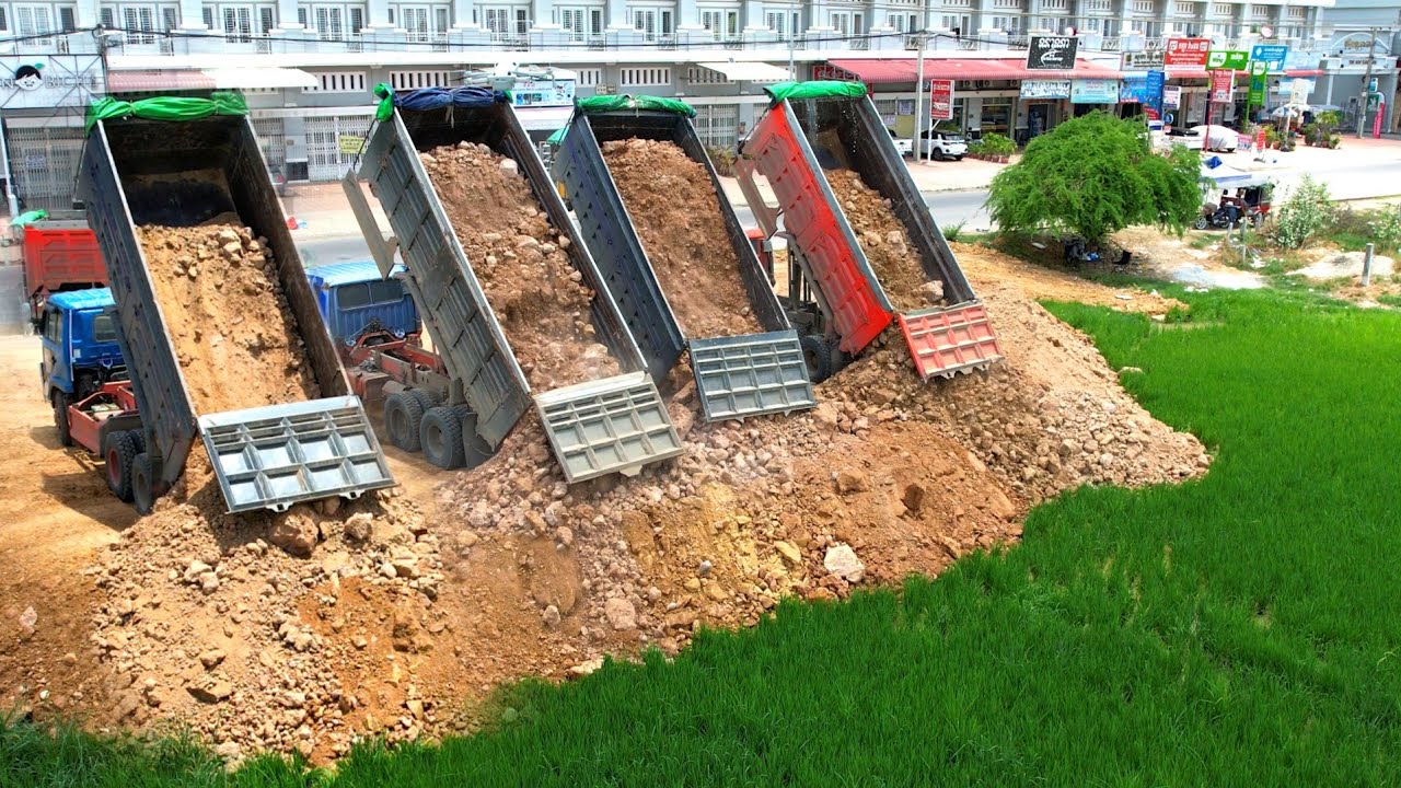 Incredible Landfilling using Wheel 10 Dump truck unloading soil with ...