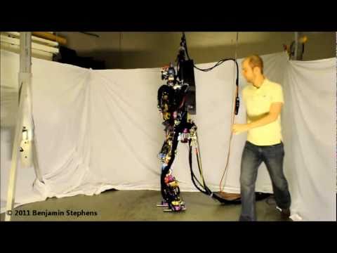 Sarcos Humanoid Robot Push Recovery While Walking in Place - YouTube