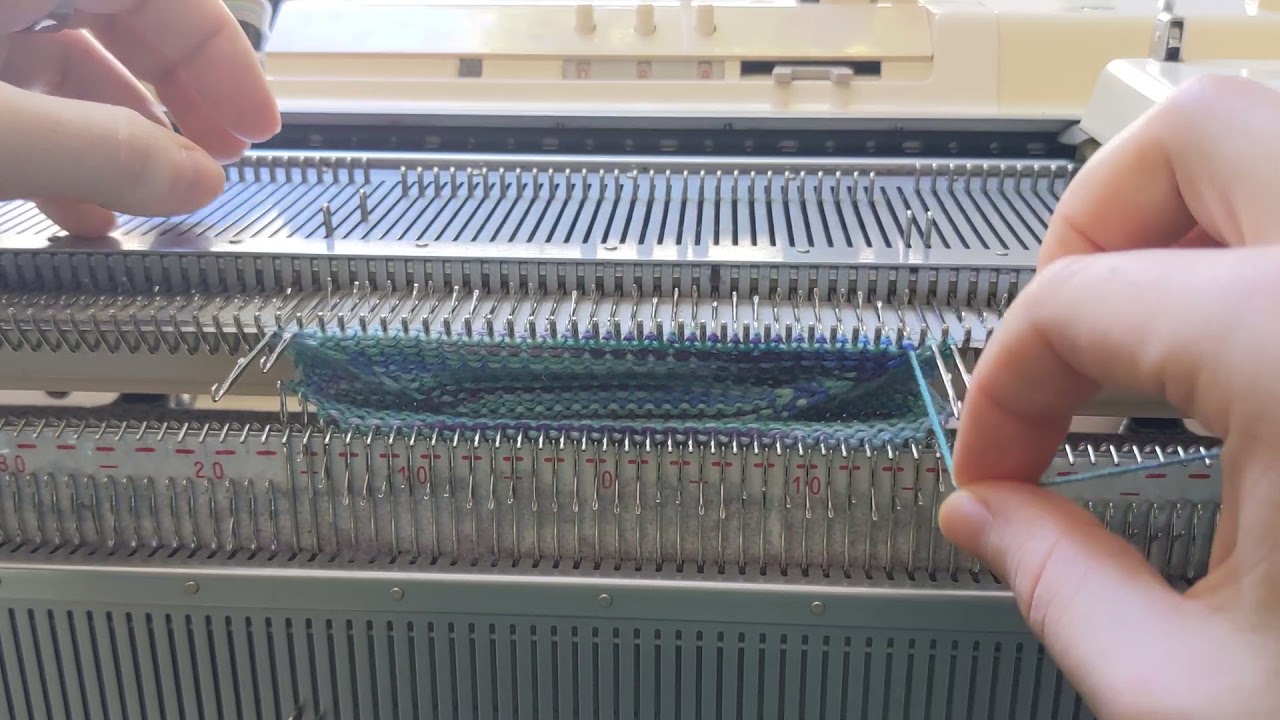 Making a sock on a Brother KH-910 with ribber attachment - YouTube