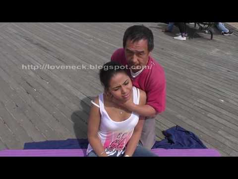 Young Girl Getting Strangle Neck Massage From Oldman 1