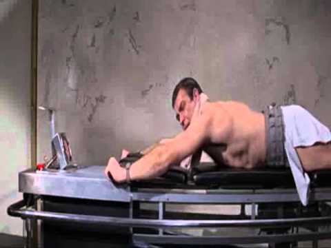 Bond gets stuck in spinal traction machine