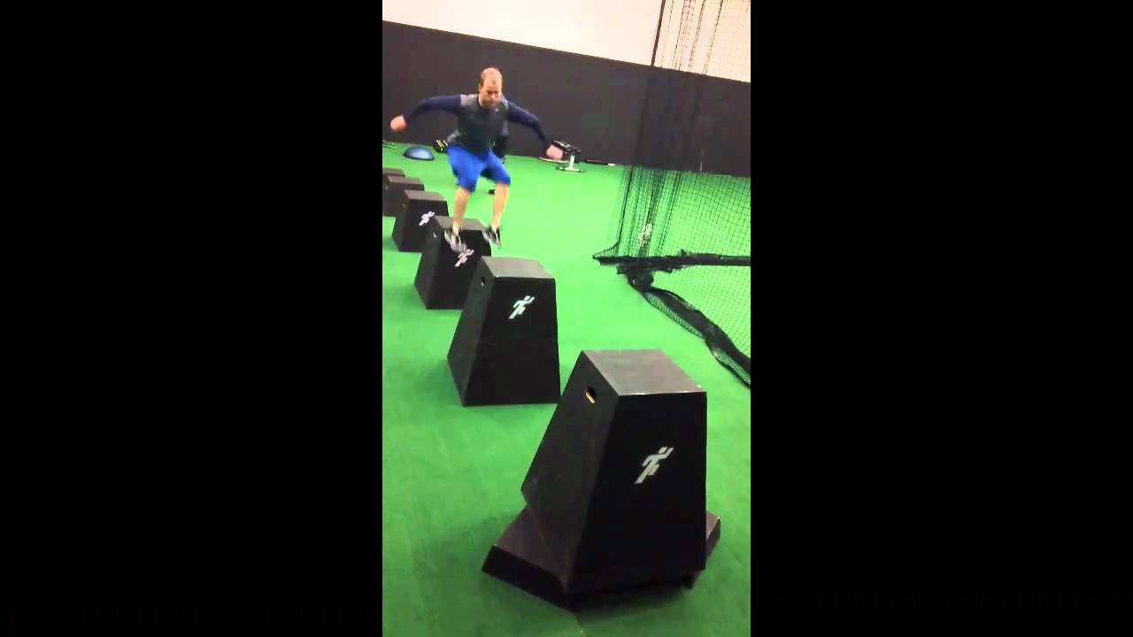 Mike Ekstrom Leaping over the Athletes In Motion plyometric boxes ...