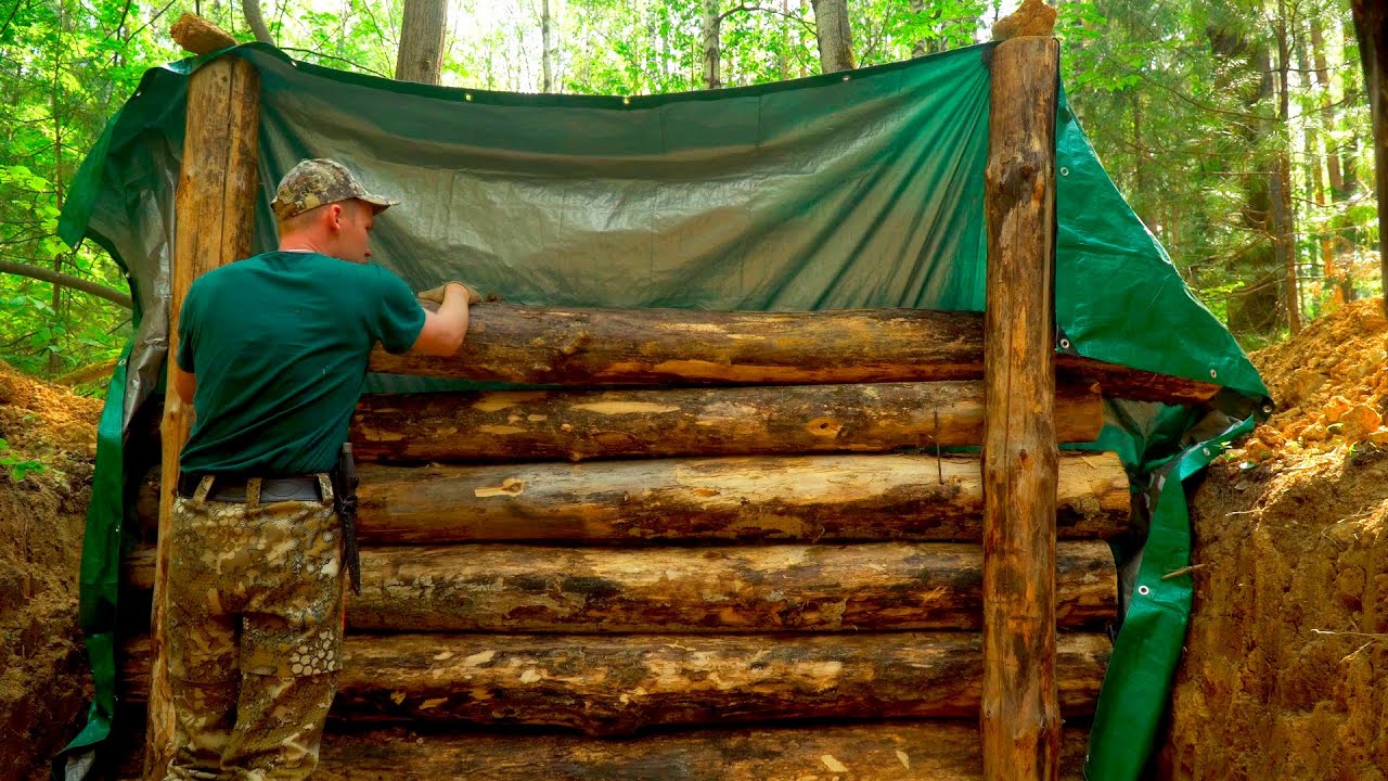 BUILDING a log underground house for SURVIVAL. A DUGOUT in a wild ...