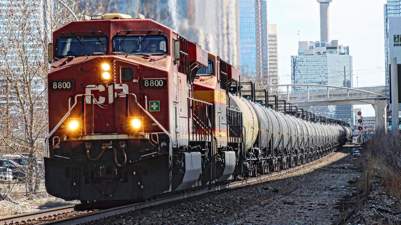 CP Mix freight train with double KCS units leaving Calgary onto the ...