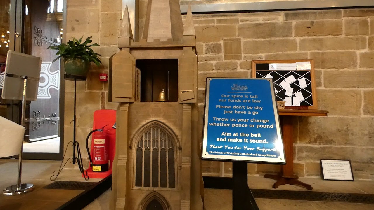 Attempting (& failing) to ring the donation bell at Wakefield Cathedral ...