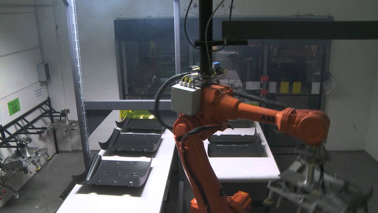 Flexible laser cutting cell with ABB IRB 4600 - YouTube