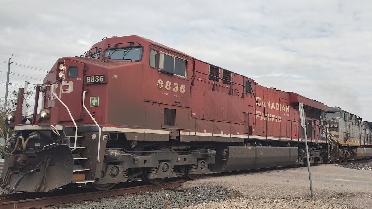 CP 8836 ES44AC leads mixed freight train ft KCS Grey Ghost - YouTube