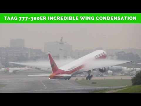 TAAG Boeing 777 300er incredible WING CONDENSATION on takeoff