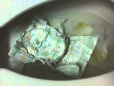 Flushing a Huggies Supreme Little Snugglers Size 1 diaper down the ...