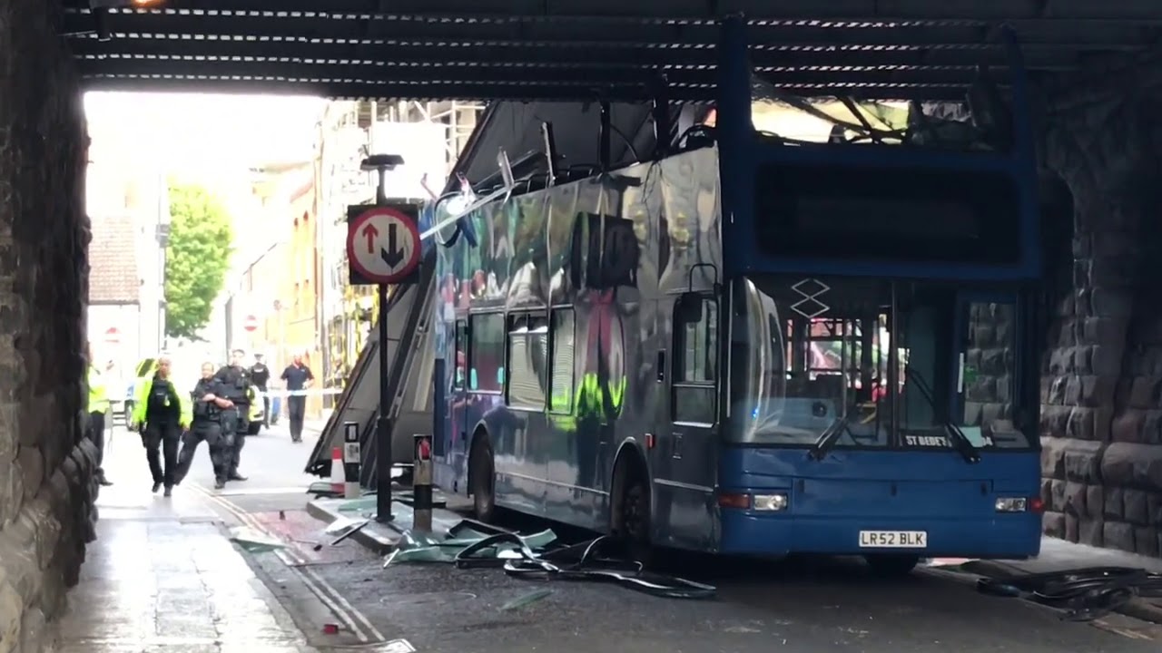 Double decker bus roof ripped off after crashing into bridge - YouTube