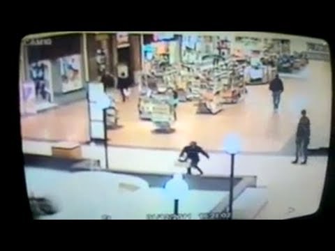Woman falls into mall fountain while texting - YouTube