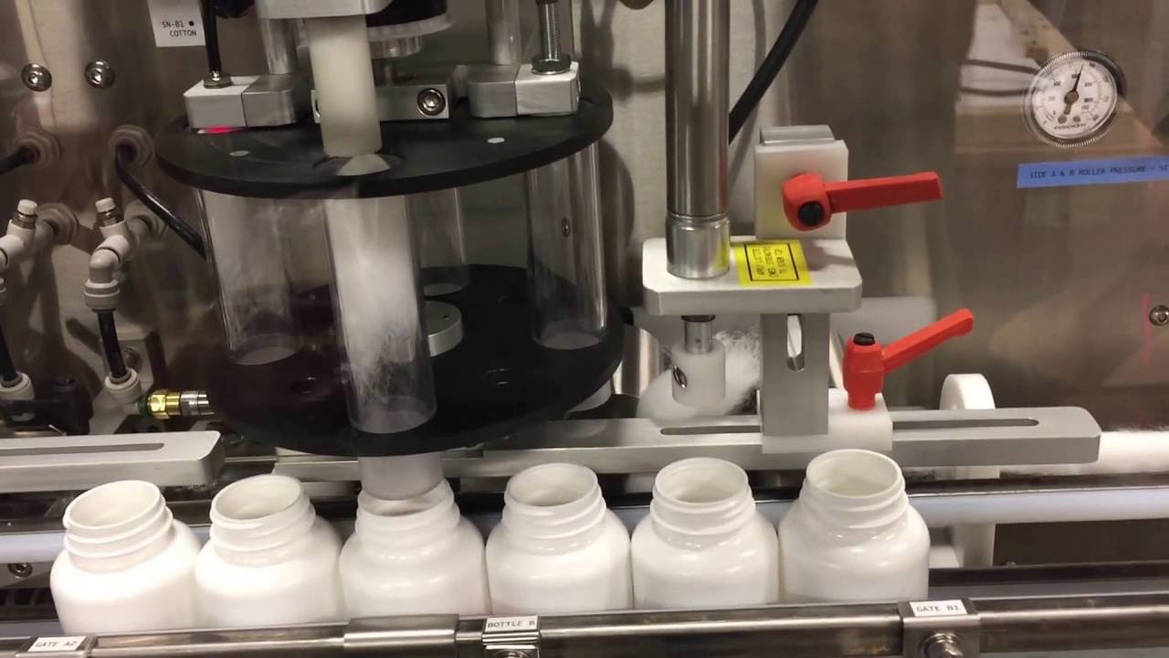 Pharmafill CS10 Dual Head Cottoner inserting machine - YouTube