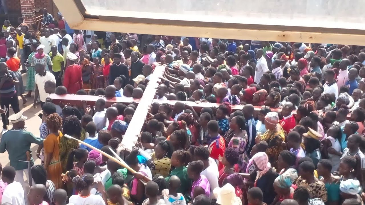 HON: MAPENDUZI, AOL BETTY OCAN CARRYING THE CROSS - YouTube