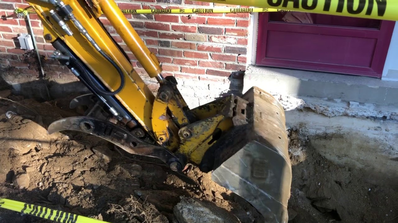 Digging down 10’ exposing foundation - YouTube