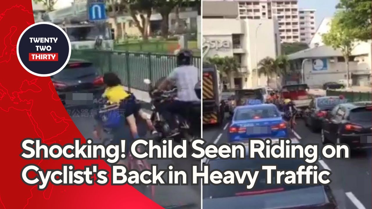 Shocking! Child Seen Riding on Cyclist's Back in Heavy Traffic ...