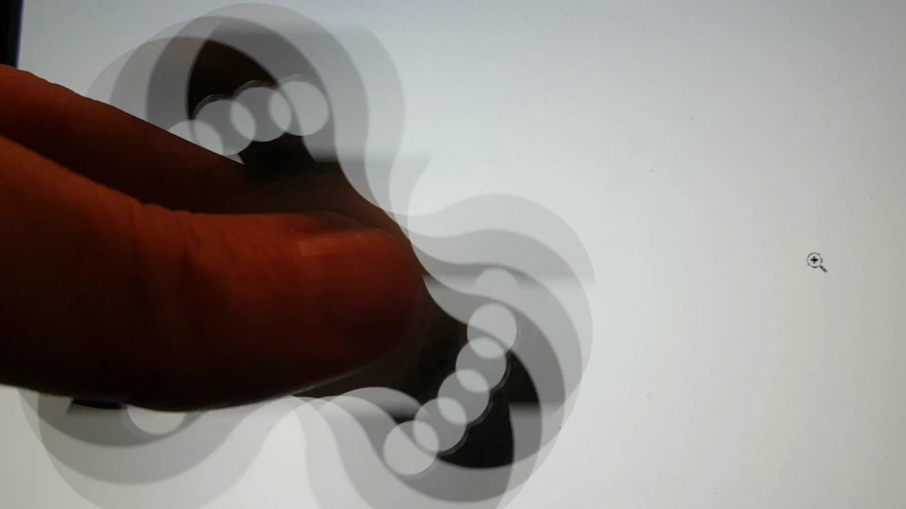 Fidget spinner and display refresh rate create a reverse-rotation ...
