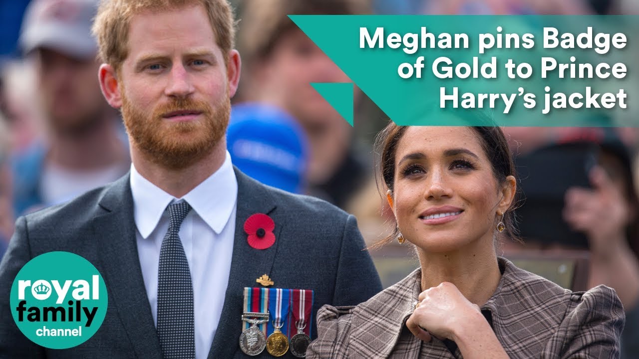 Meghan pins Badge of Gold to Prince Harry’s jacket - YouTube