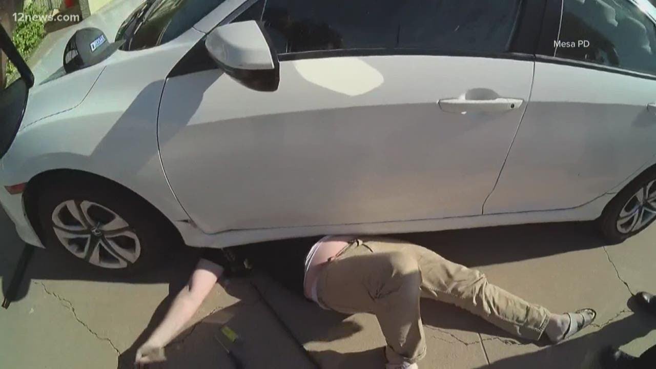 Dramatic video shows Mesa officers rescuing man pinned under car - YouTube
