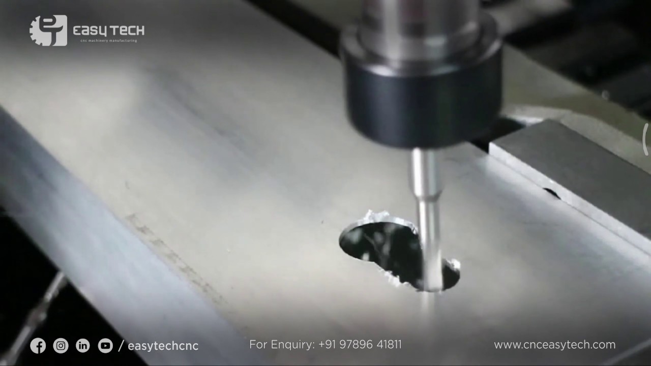 Watch CNC Router machine drilling a key hole in a metal piece ...
