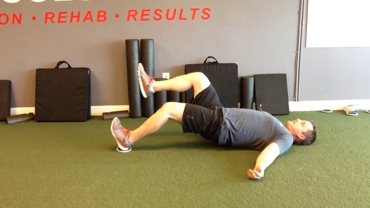 SL bridge w/ eccentric slider hamstring curl - EBM Fitness Solutions ...
