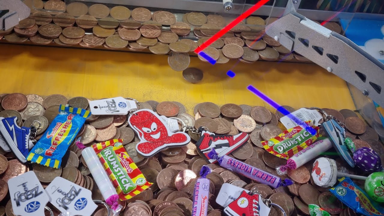 playing lady bug 2p coin pusher winning prizes - YouTube