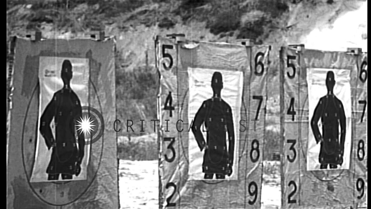 FBI Special Agents in training fire at targets on a firing range in the ...