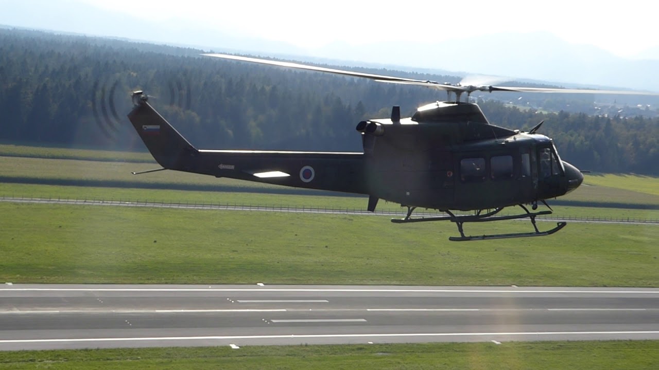 Bell 412 air to air during landing - YouTube