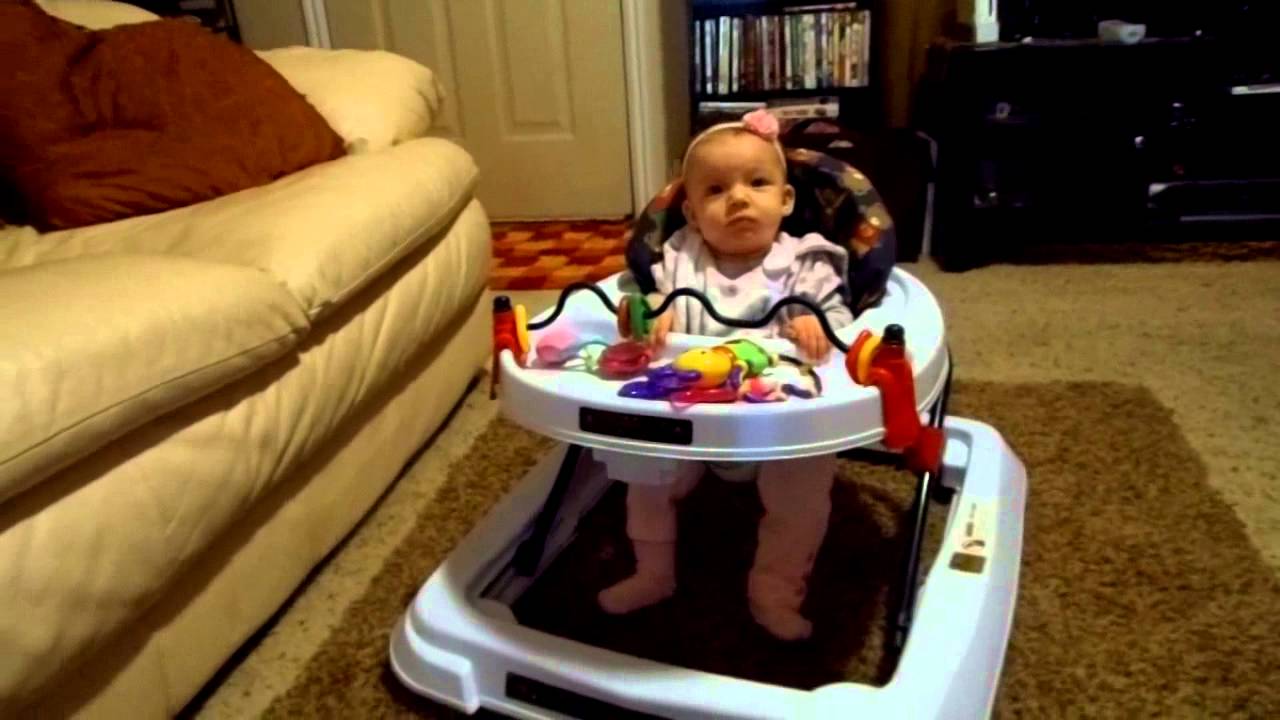 Londyn 18 weeks old walking backwards in walker - YouTube