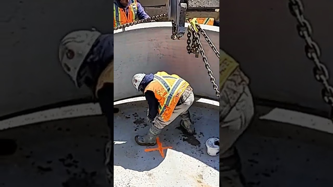 installing large manhole putting grease - YouTube