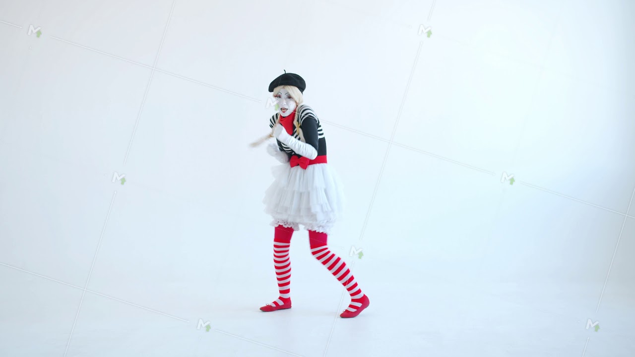 Female mime artist dancing gesturing having fun alone on white ...