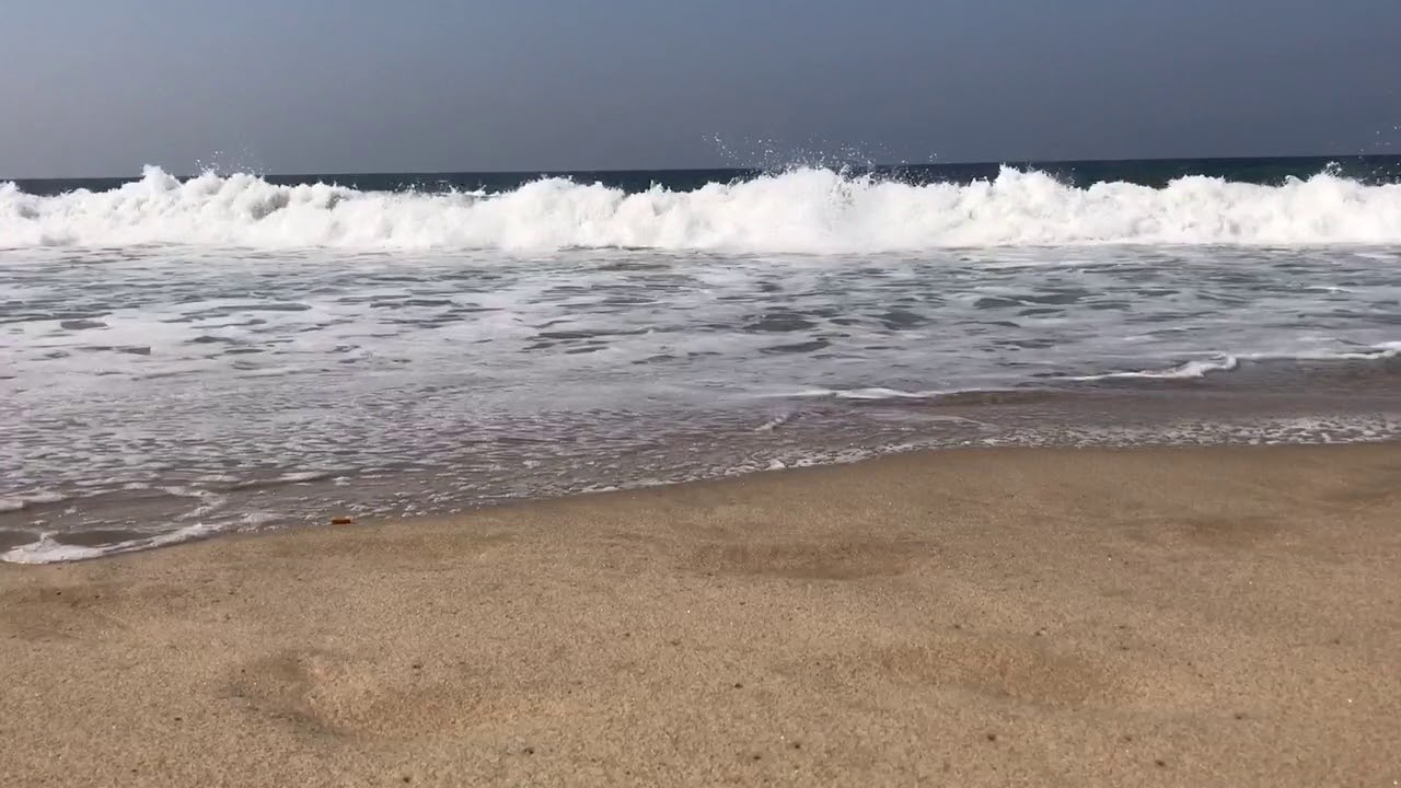 Waves crashing on the beach - YouTube